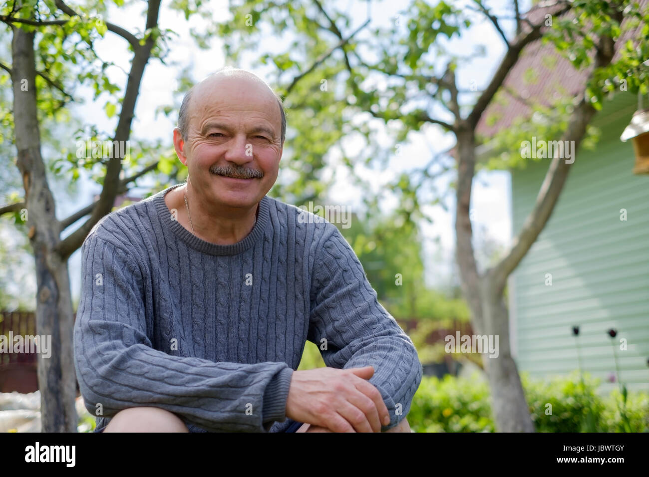 Portrait handsome senior man gardening hi-res stock photography and ...
