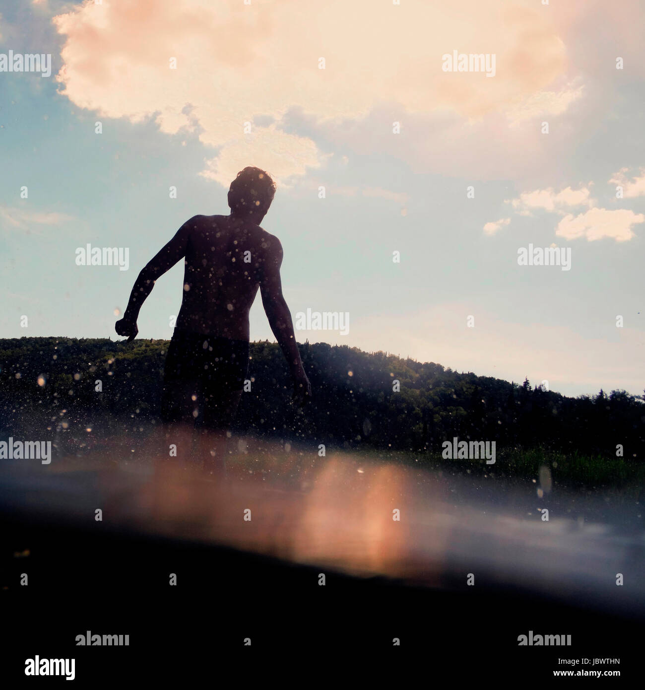 Man splashing in water, Ural, Russia Stock Photo - Alamy