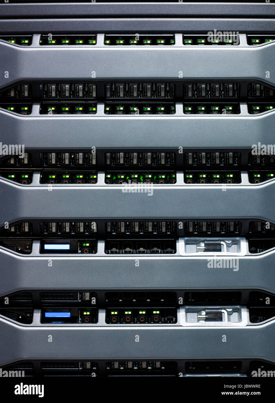 Detail of green led lights on data storage equipment in data centre ...