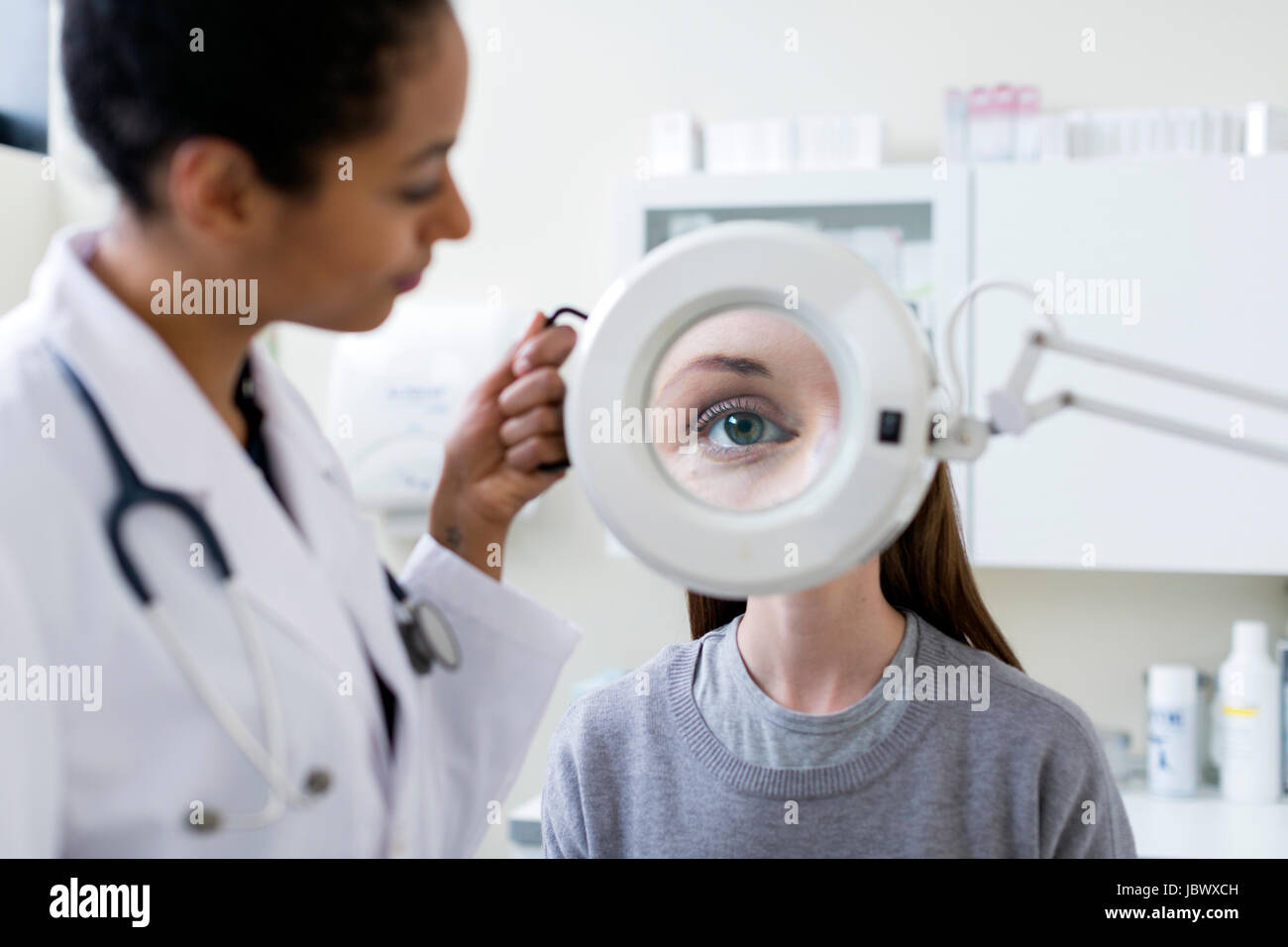 Doctor giving patient eye test Stock Photo - Alamy