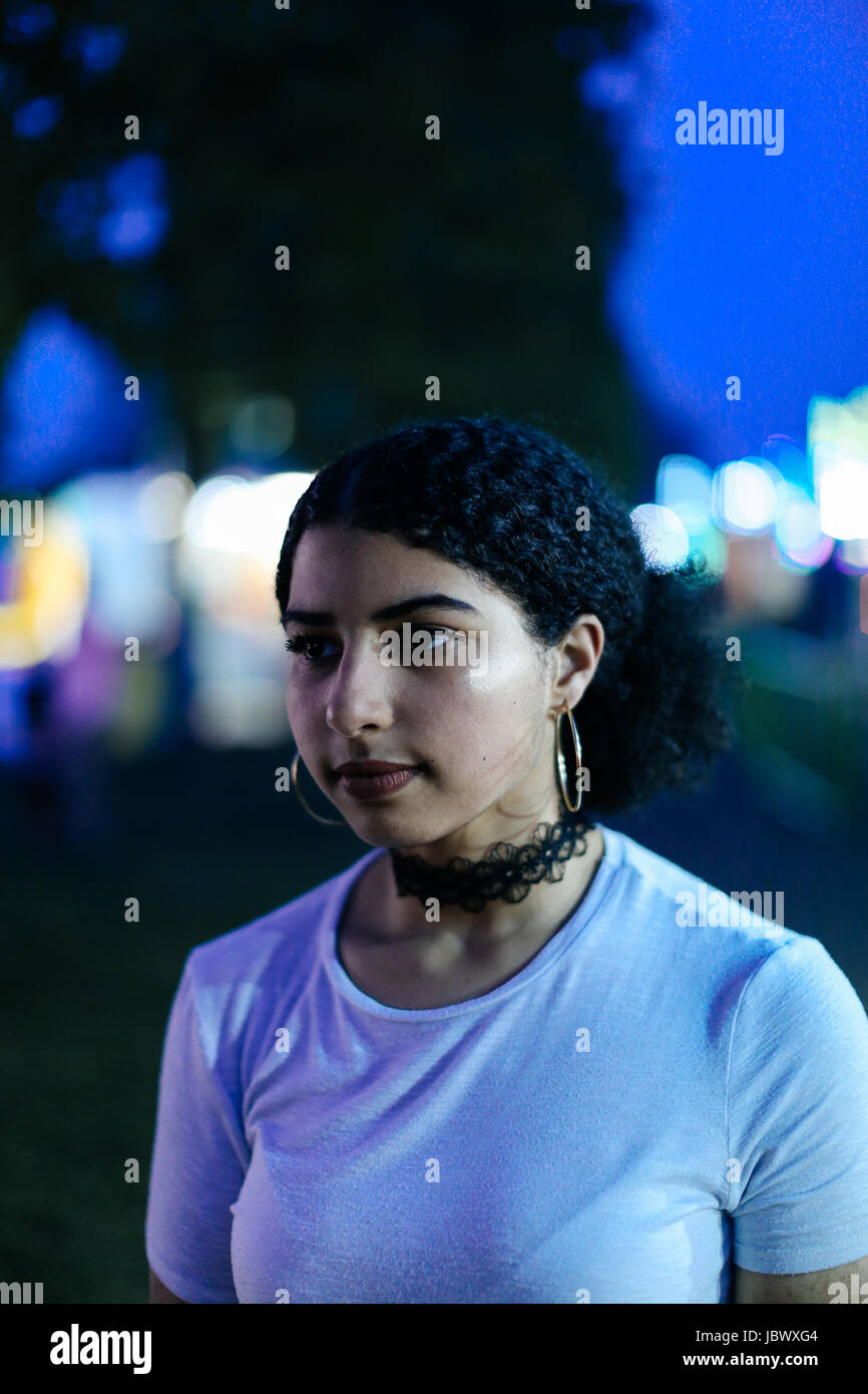 Portrait of teenage girl at funfair at night Stock Photo - Alamy