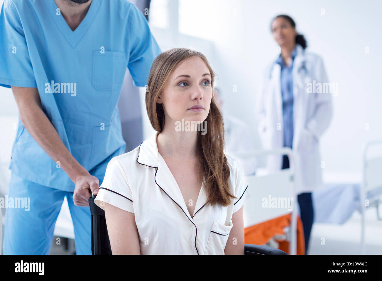 Doctor male nurse pushing hospital hi-res stock photography and images ...