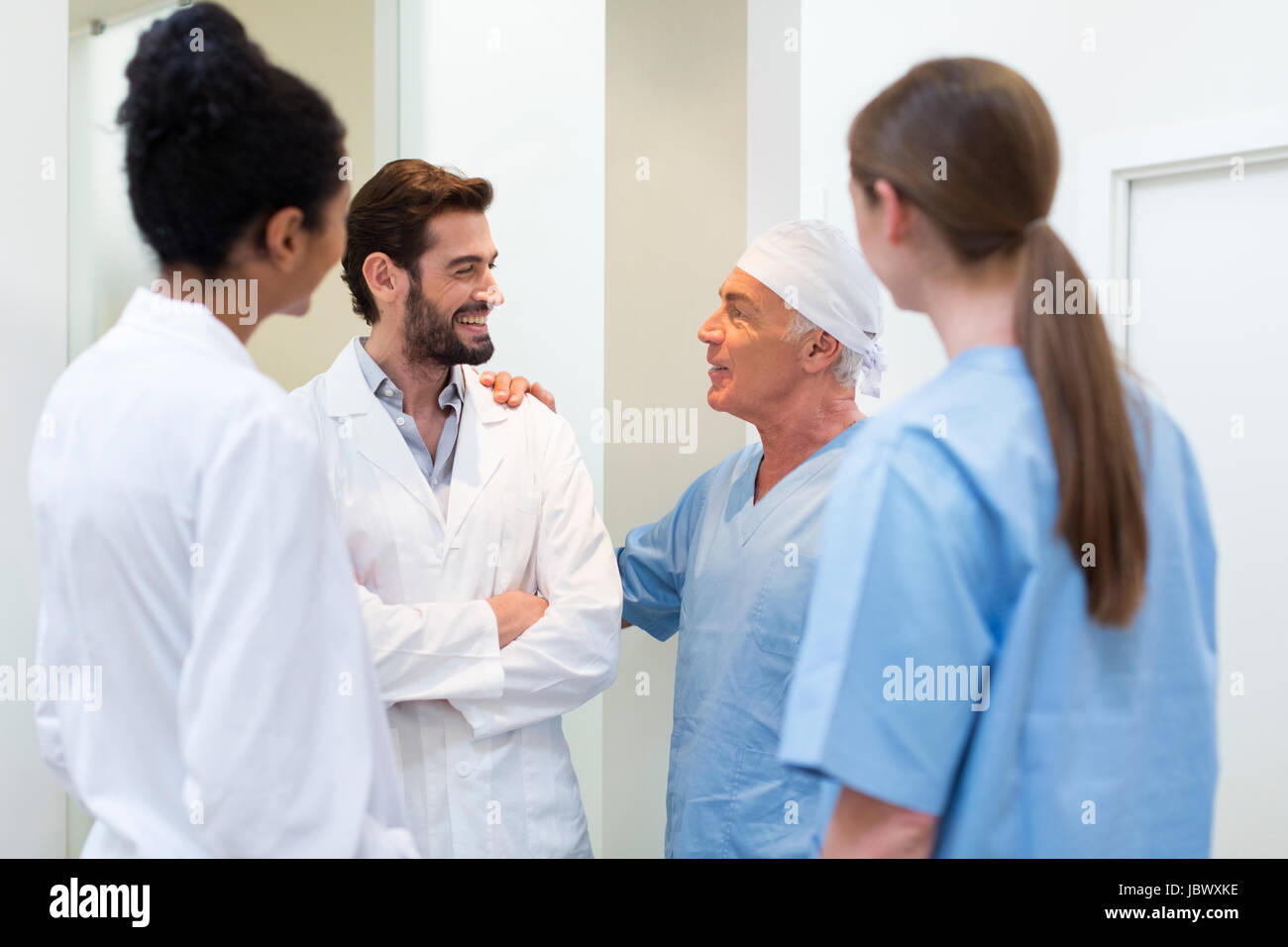 Group of doctors talking in hospital Stock Photo - Alamy