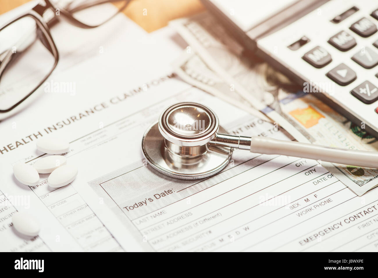 Cost of health care concept, stethoscope and calculator on table Stock ...