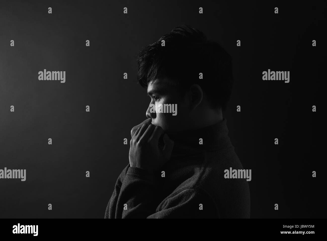 Portrait of sad young asian men. Sadness Stock Photo - Alamy