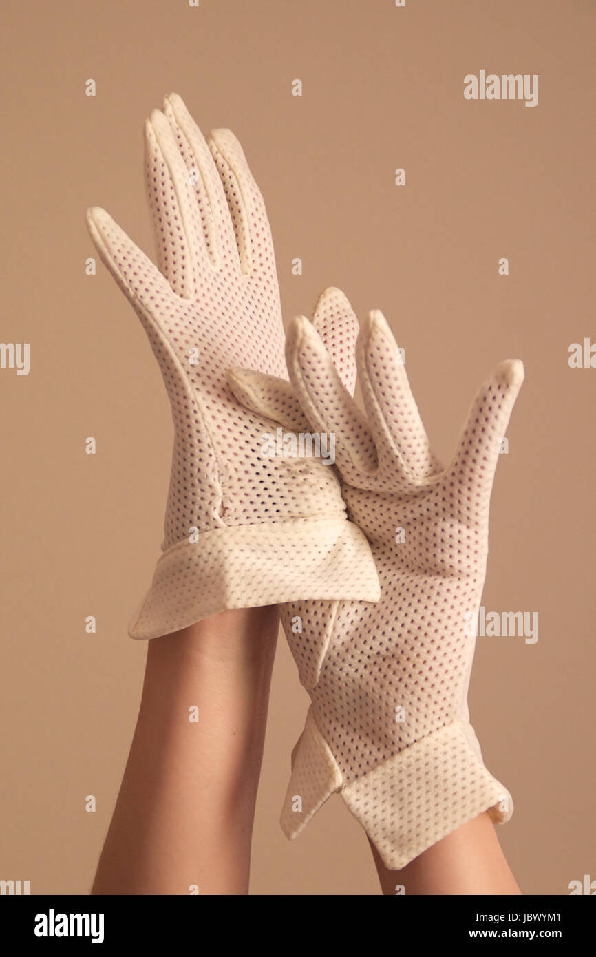 A woman's hands and forearms are shown as she models a vintage pair of ...
