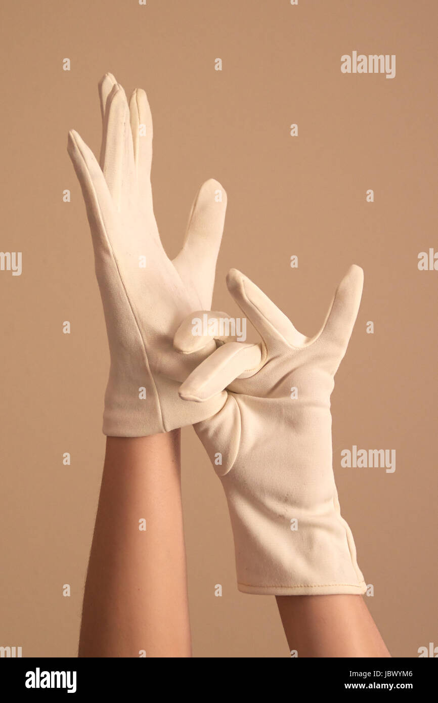 A woman's hands and forearms are shown as she models a vintage pair of ...