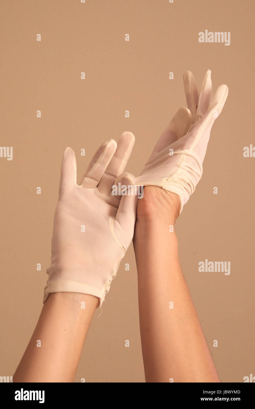 A woman's hands and forearms are shown as she models a vintage pair of ...