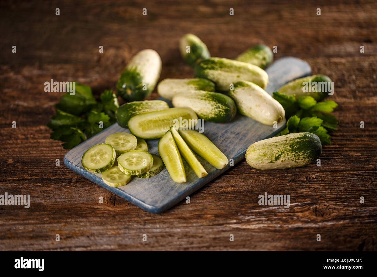 Composition of fresh cucumbers, slices and whole Stock Photo - Alamy