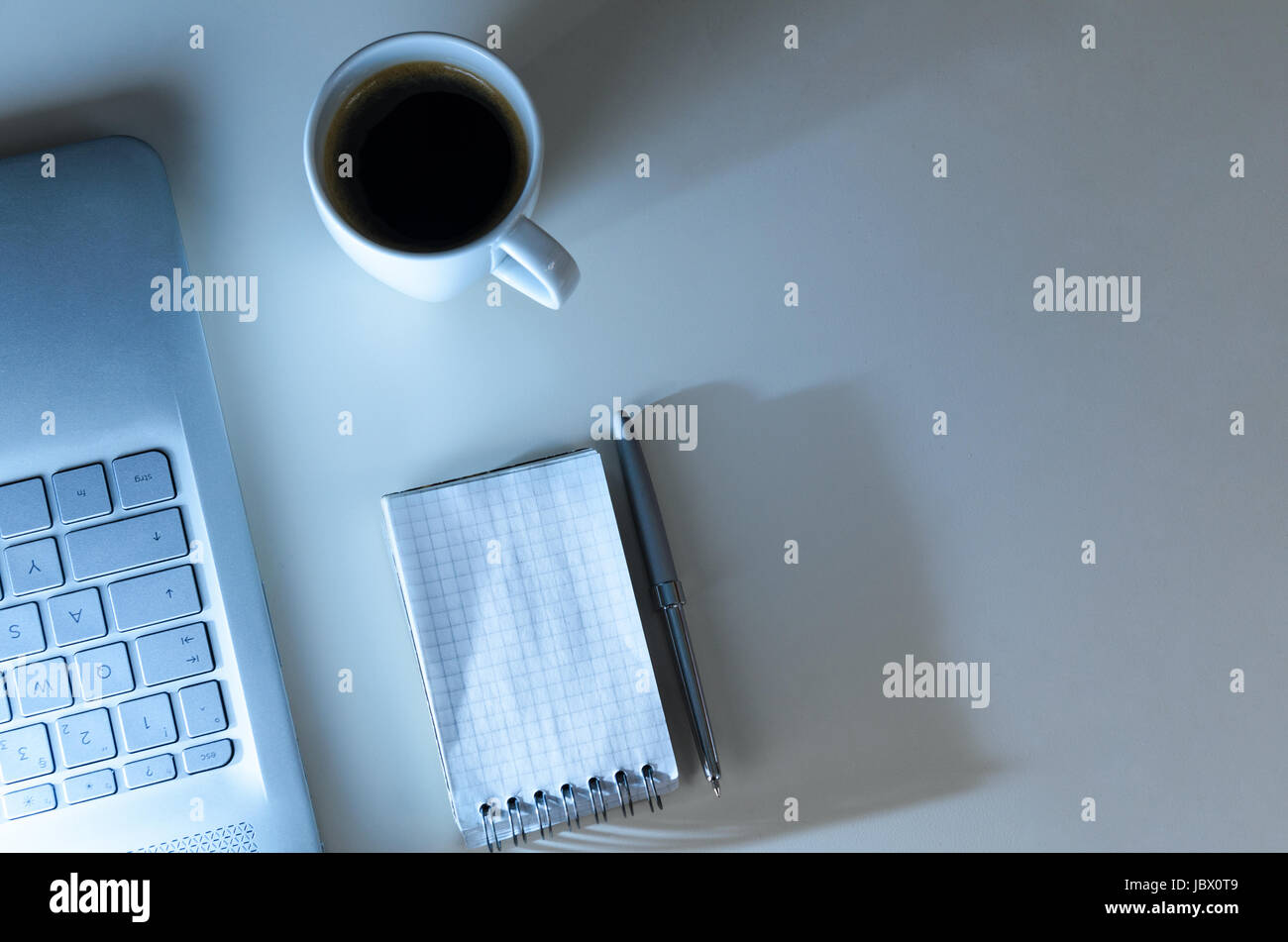 Evening work place and laptop Stock Photo - Alamy