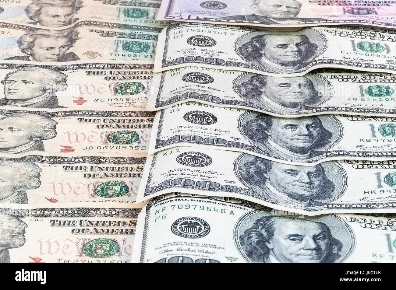 Closeup of dollar banknotes laying in a row forming a money background ...