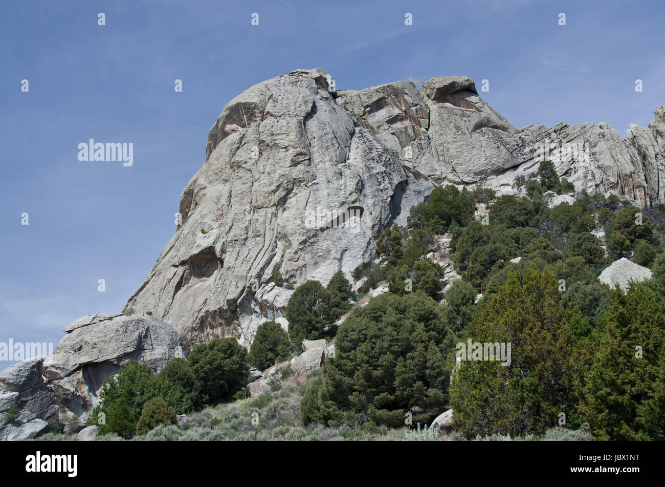 Castle Rock Above the Trees Stock Photo - Alamy