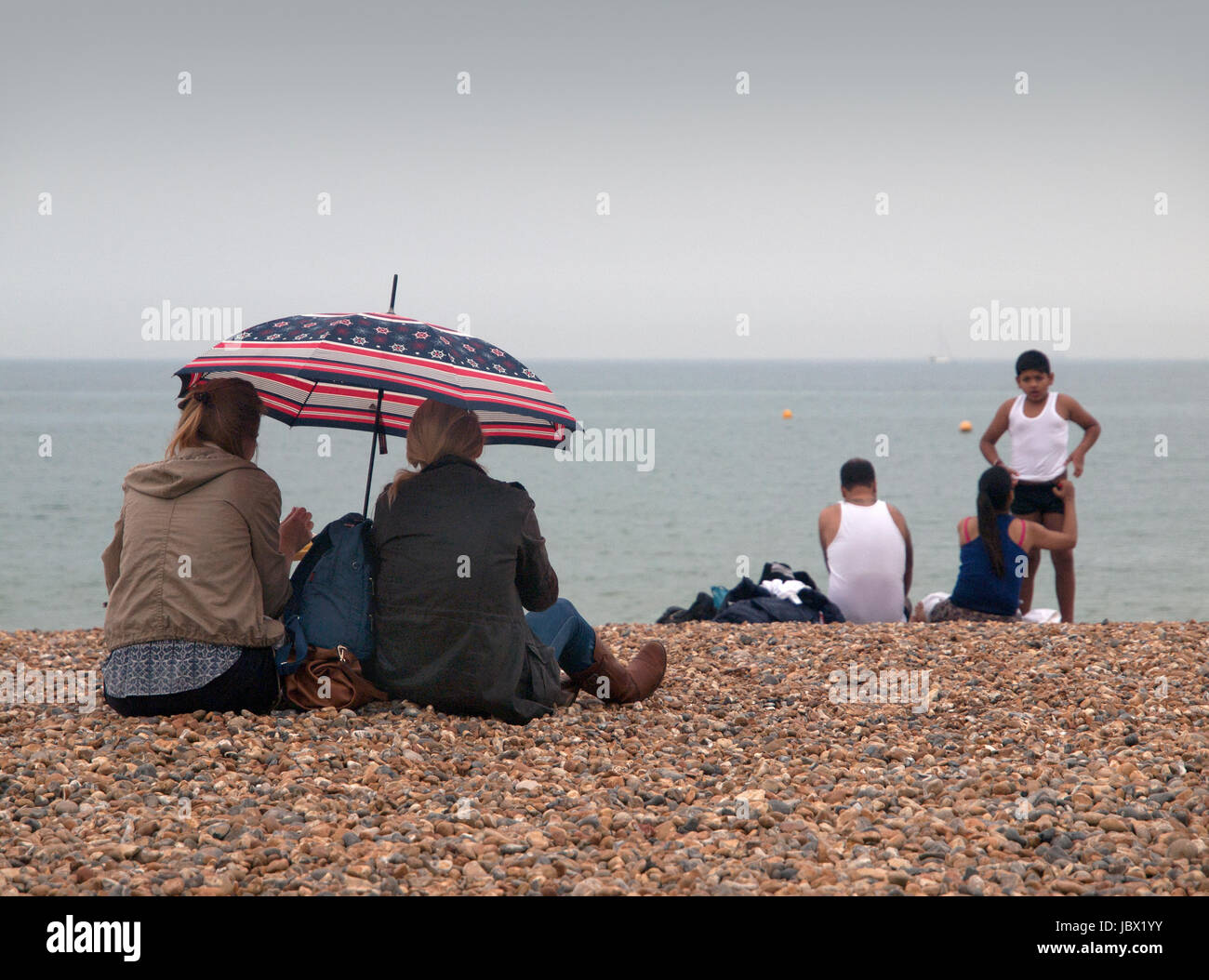 A wet day on the beach at Brighton Stock Photo - Alamy