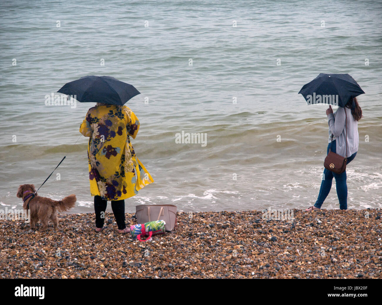 A wet day on the beach at Brighton Stock Photo - Alamy