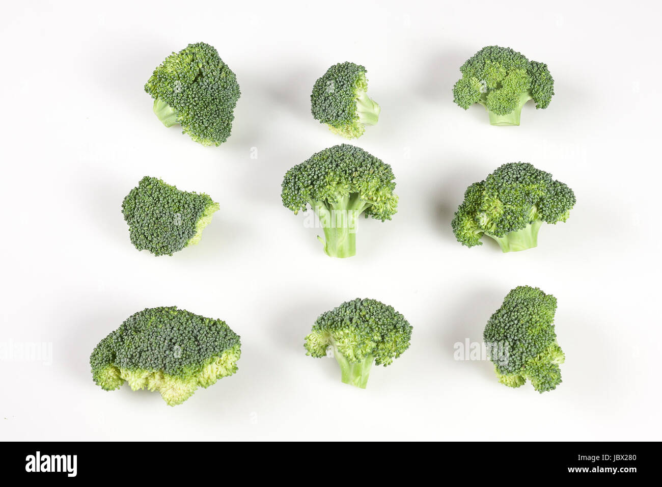 Set of ripe broccoli pieces isolated on white background Stock Photo ...