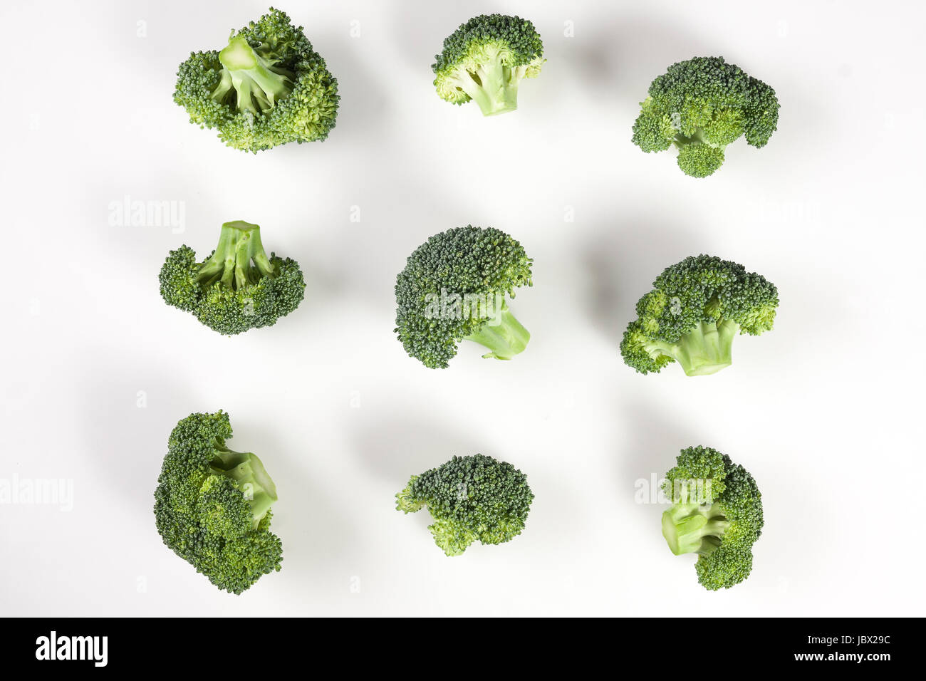 Set of ripe broccoli pieces isolated on white background Stock Photo ...
