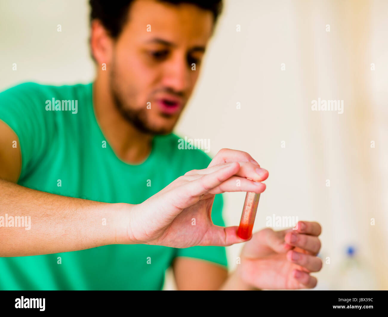 A man demonstrating the science experiment for the children in the ...