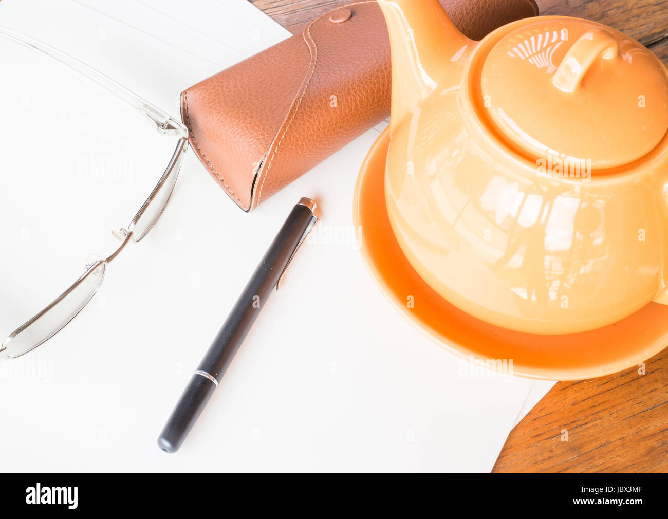 Tea time on working wooden table, stock photo Stock Photo - Alamy