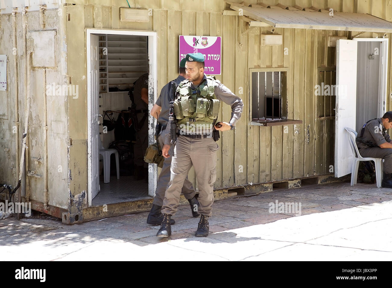 Israeli soldier with assault rifle at the check point between jewish ...