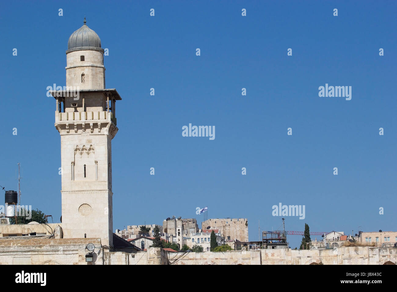 Mosque minaret at the Templa Mount with israeli flags in the background ...