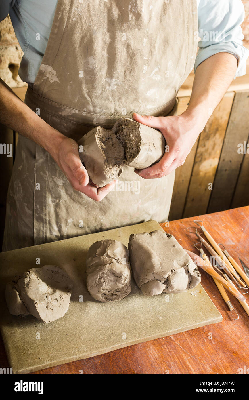 potter, clay, ceramics art concept - top view on hands of young master ...