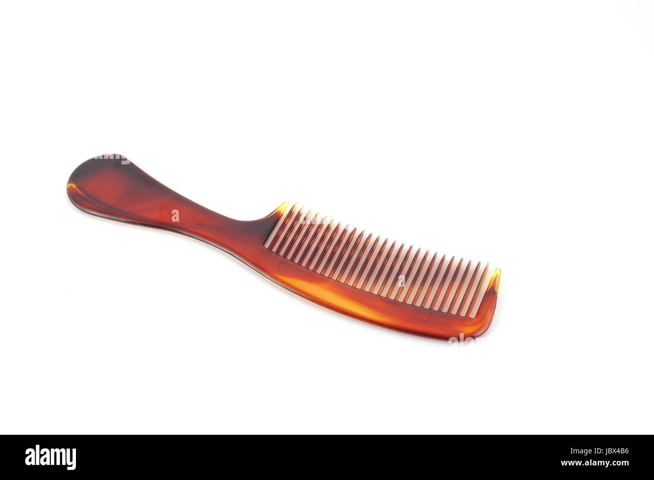 Single plastic comb over white Stock Photo - Alamy