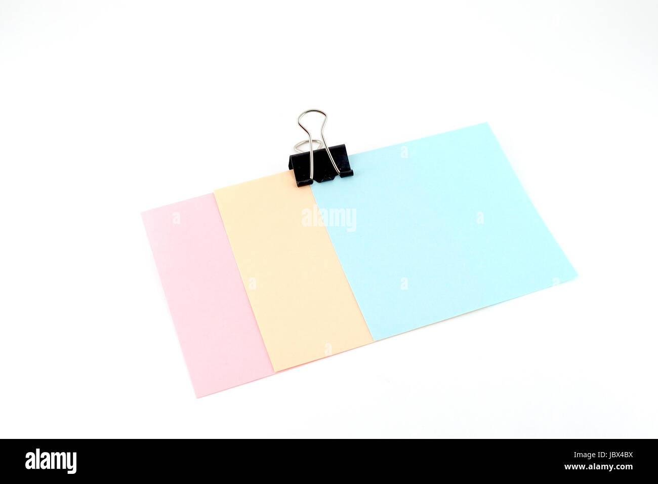 Three color reminder notes with clip for paper over white Stock Photo ...