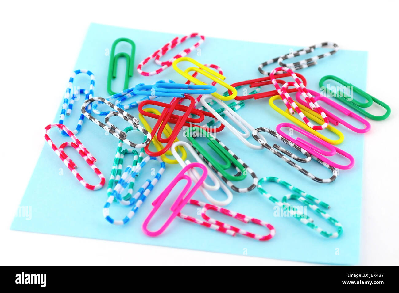 Office clips for paper on the reminder note Stock Photo - Alamy