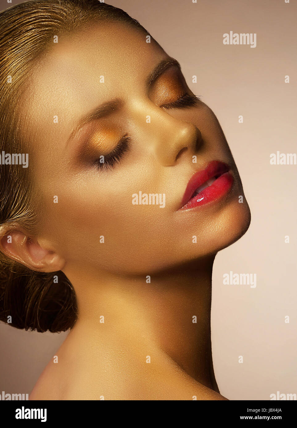Bodypainting. Gilded Woman's Face. Fancy Golden Make Up Stock Photo - Alamy