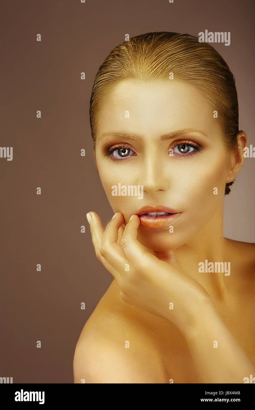 Pure Beauty. Gilded Woman's Face Stock Photo - Alamy
