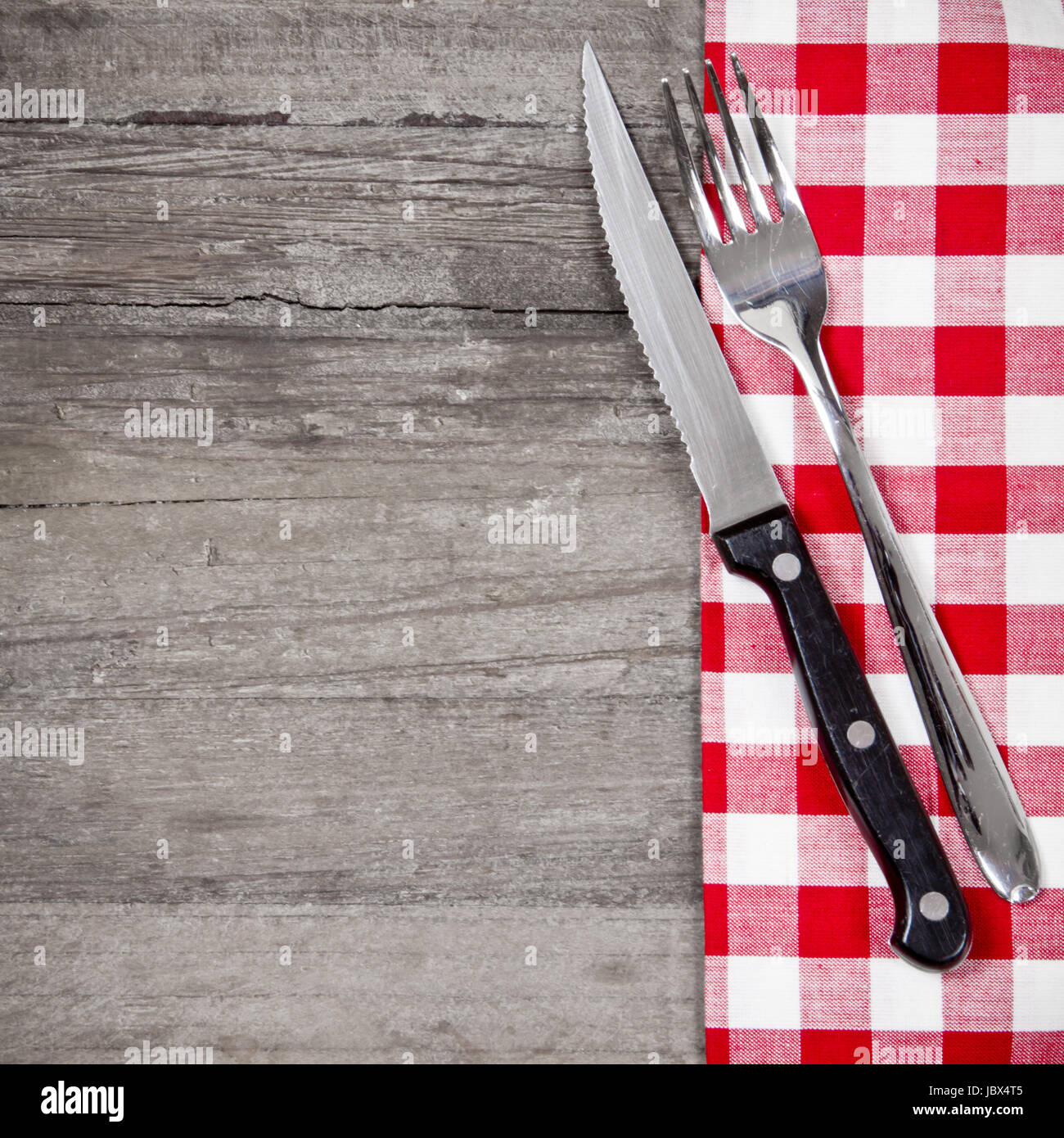 cutlery on wooden table Stock Photo - Alamy