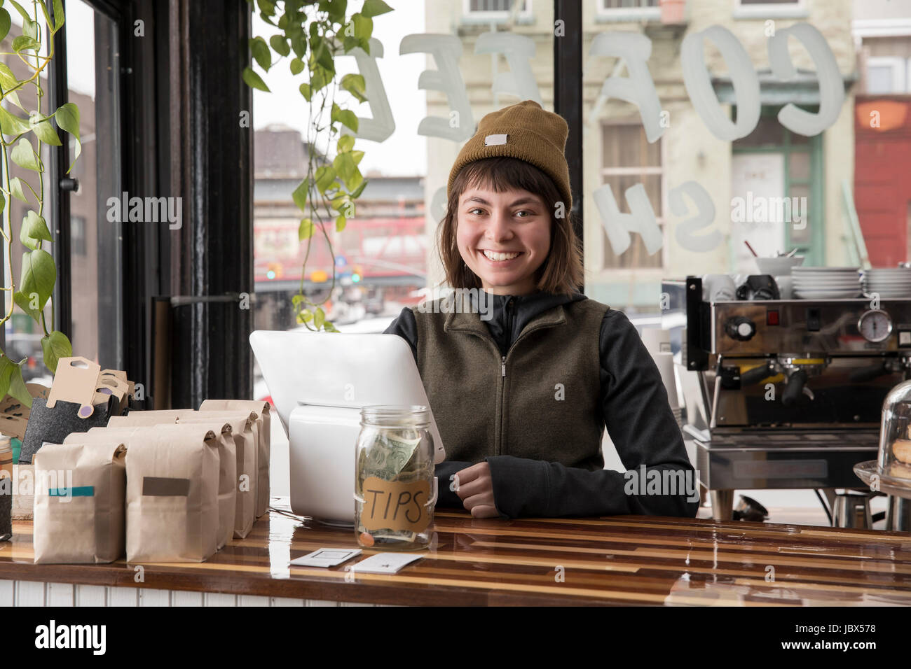 Female employee in cafe, New York, USA Stock Photo - Alamy