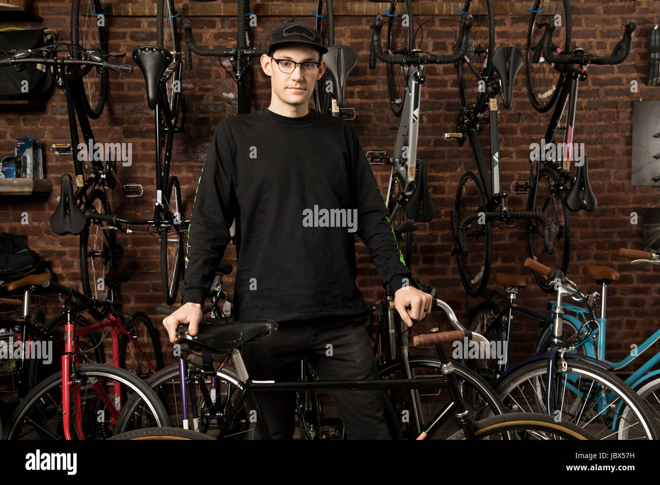 Man in bicycle shop Stock Photo - Alamy