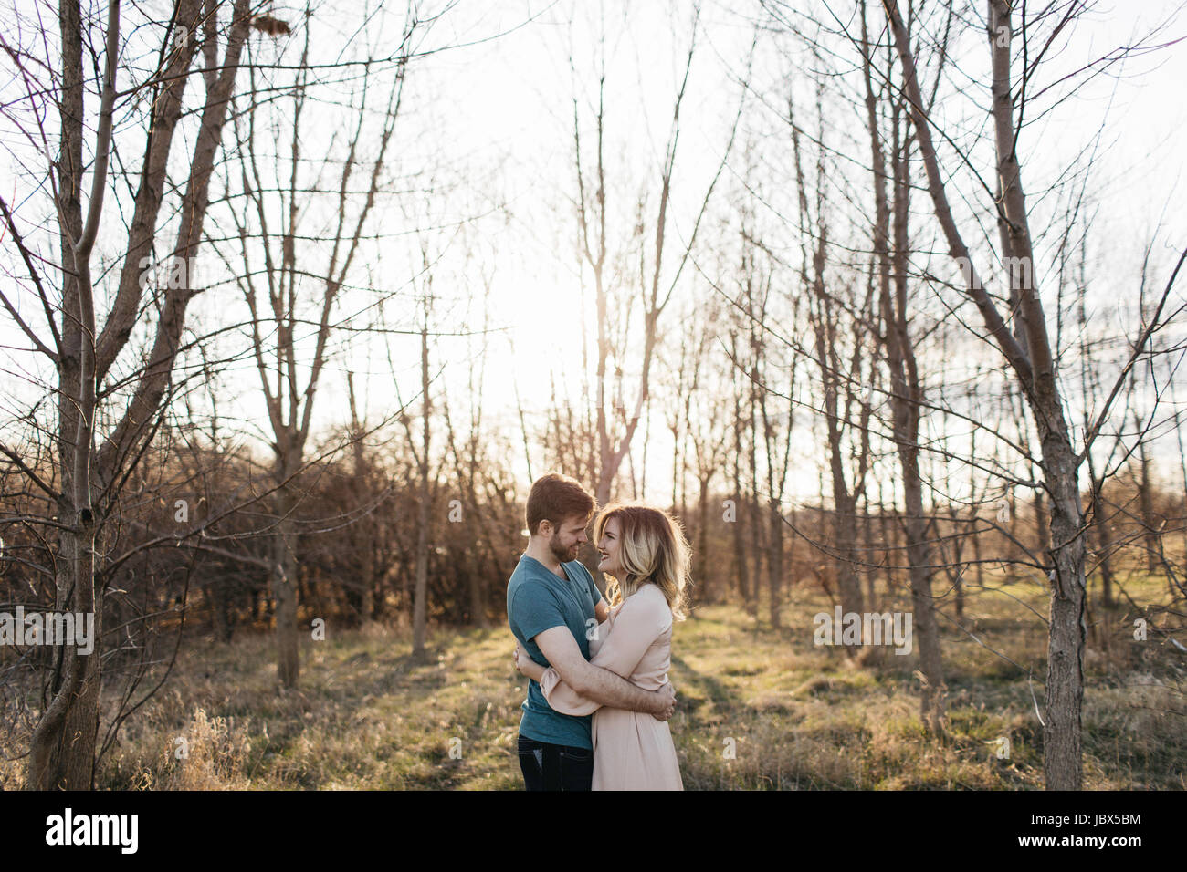 Couple hugging in rural setting Stock Photo - Alamy