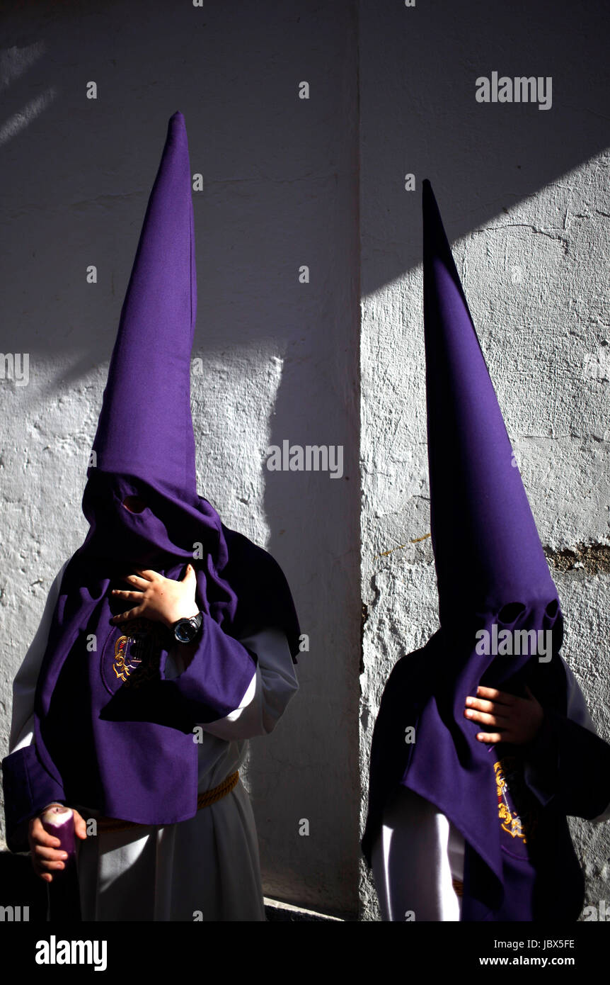 Penitents wearing pointed hoods during Easter Week celebrations in ...