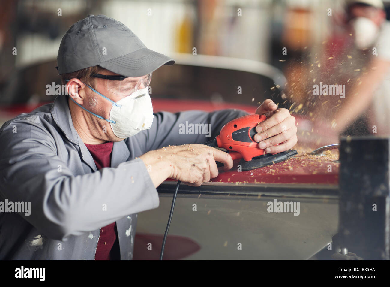 Man sanding boat hi-res stock photography and images - Alamy