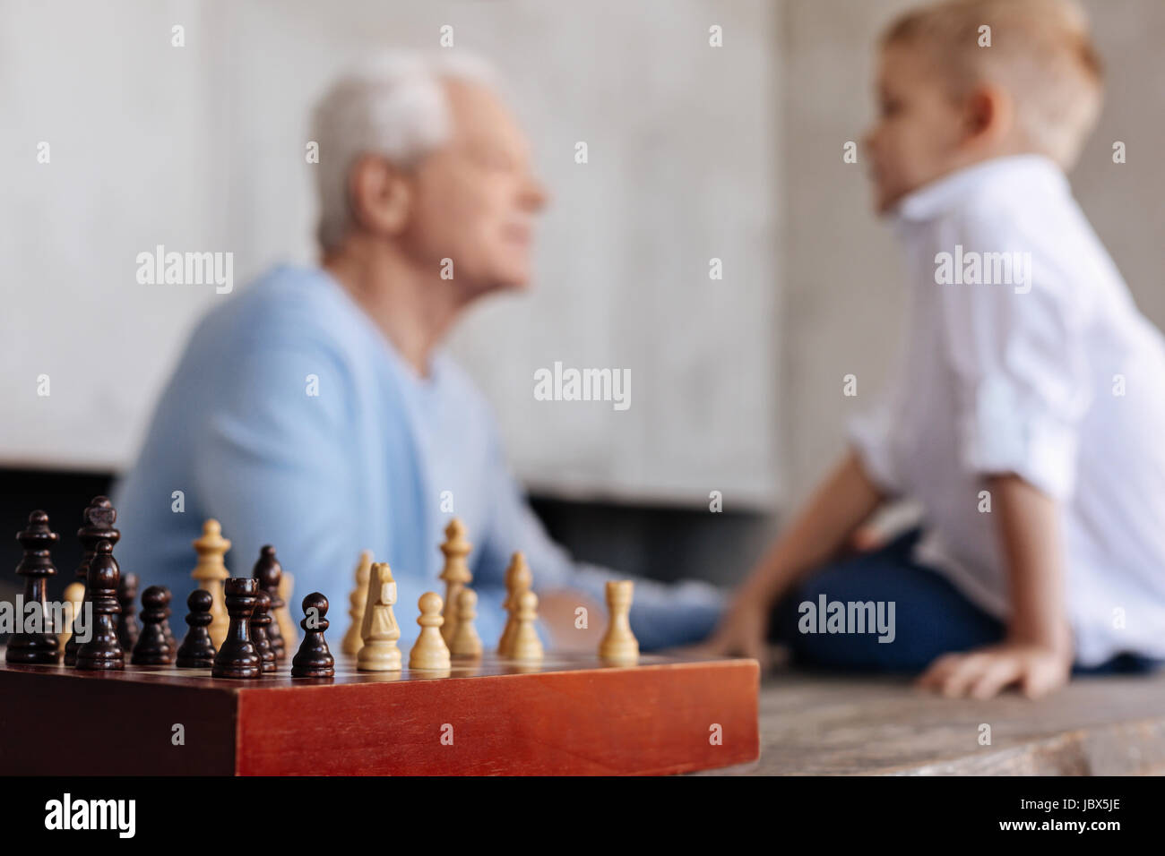 Adorable family members enjoying a nice conversation Stock Photo - Alamy