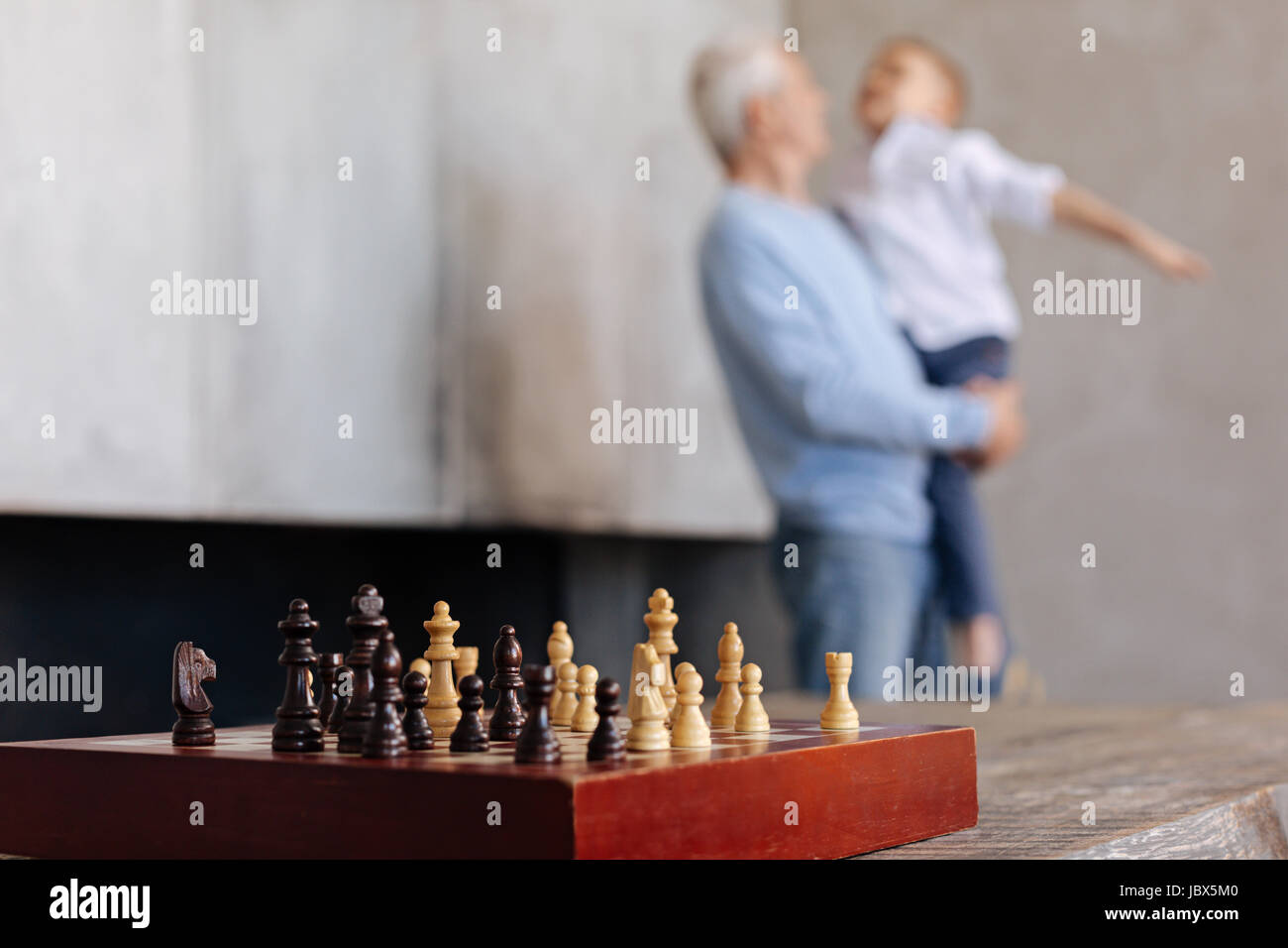 Bright active men resting after a game of chess Stock Photo - Alamy