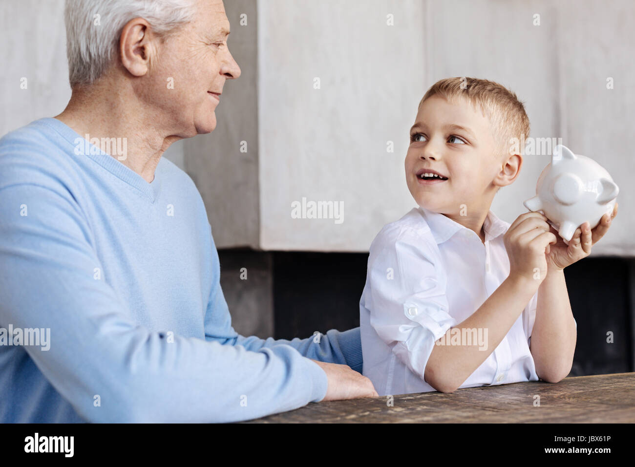 Thoughtful bright kid asking questions about money Stock Photo - Alamy