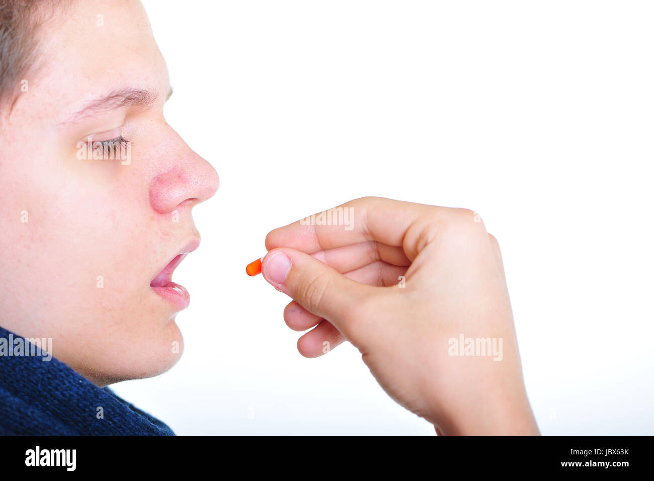 young man takes a drug Stock Photo - Alamy