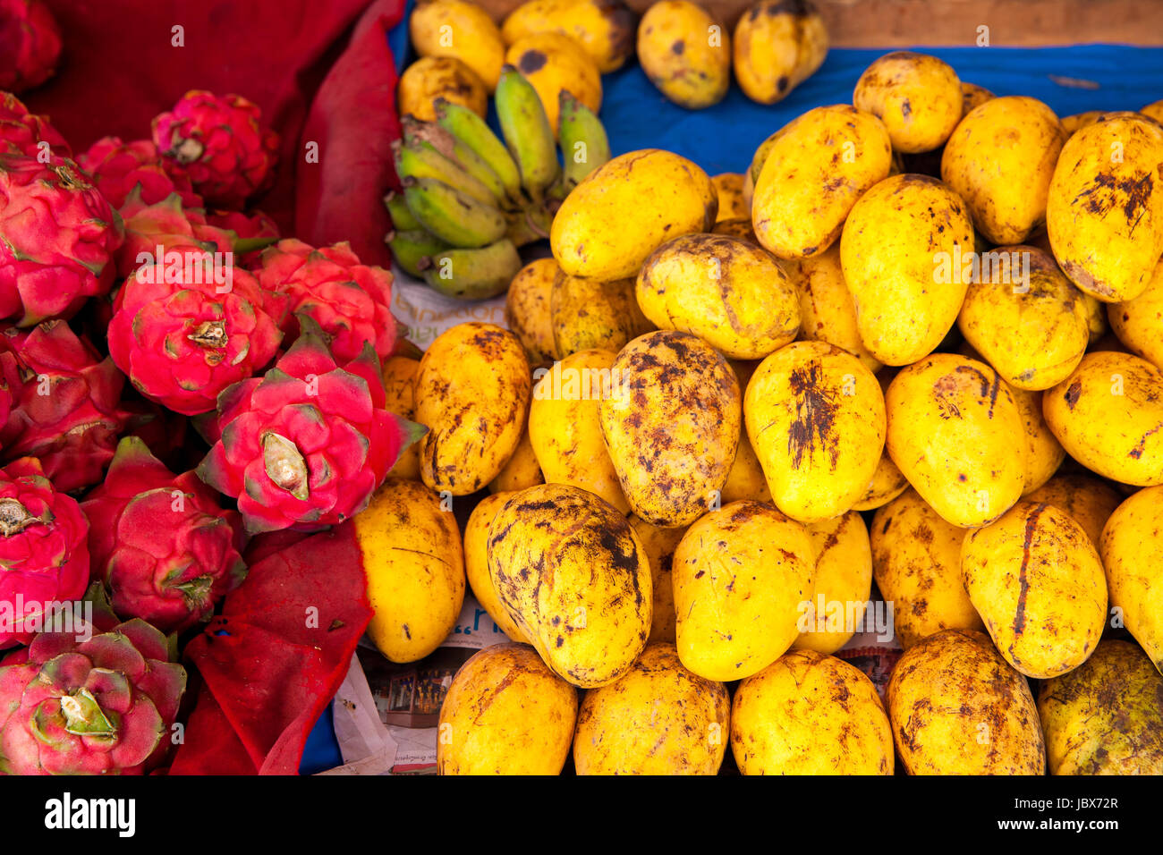 Mangoes and dragon fruits at the market stall in Chiang Mai, Thailand ...
