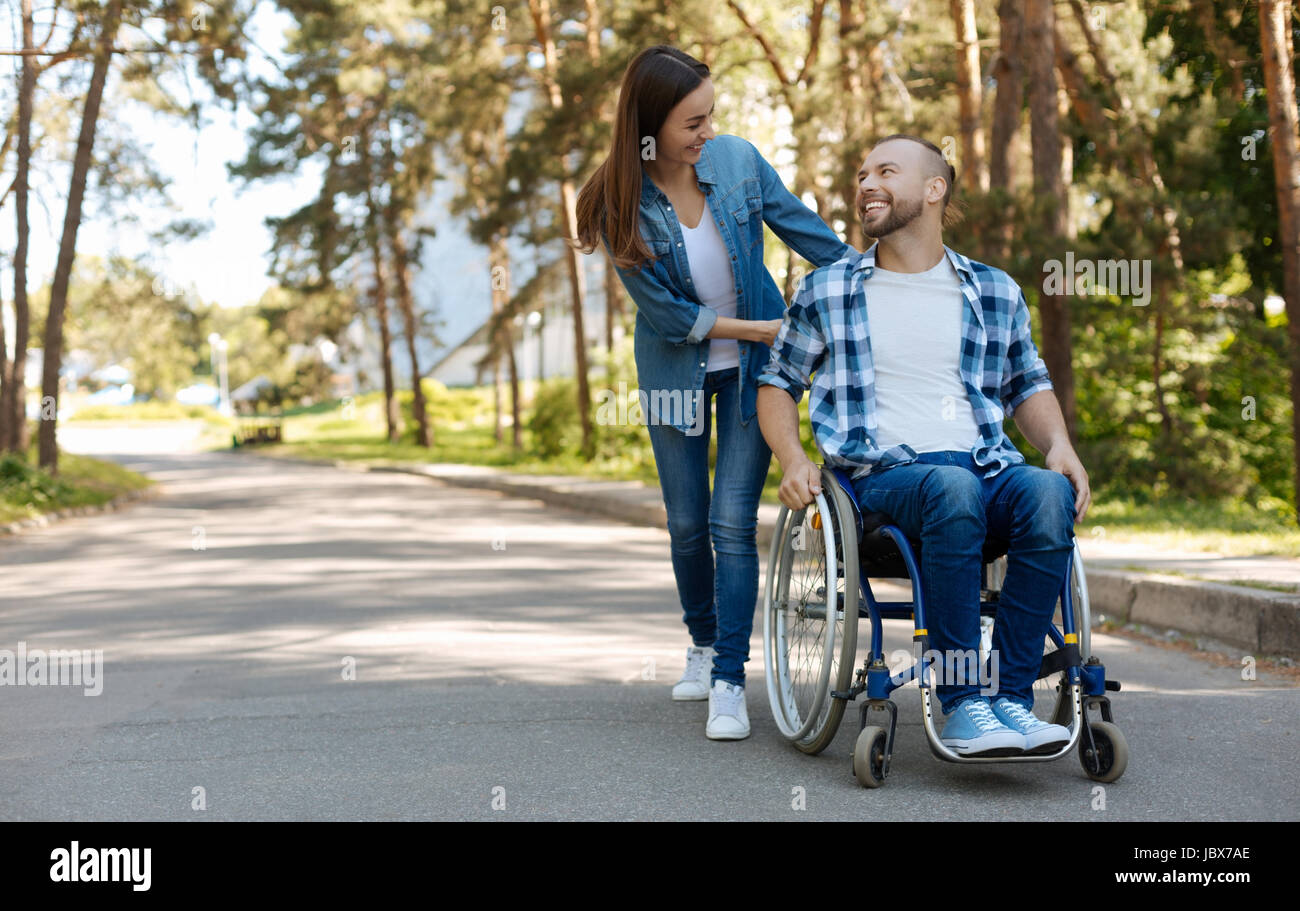 Positive delighted disabled man expressing positivity Stock Photo - Alamy