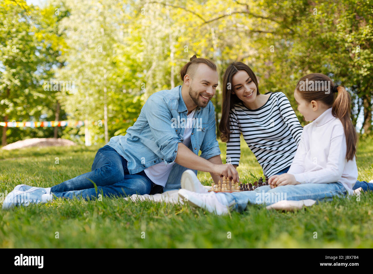 Delighted man playing chess with his opponent Stock Photo - Alamy