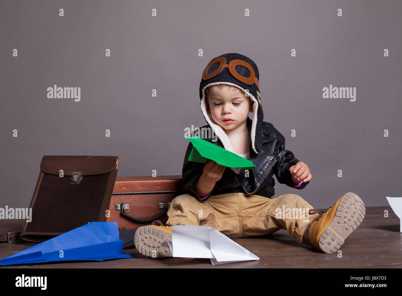 little boy pilot plays in the paper plane 1 Stock Photo - Alamy
