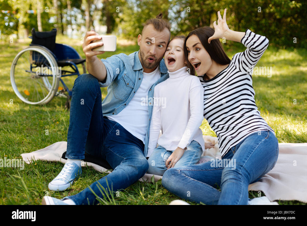 Funny family members while making faces Stock Photo - Alamy
