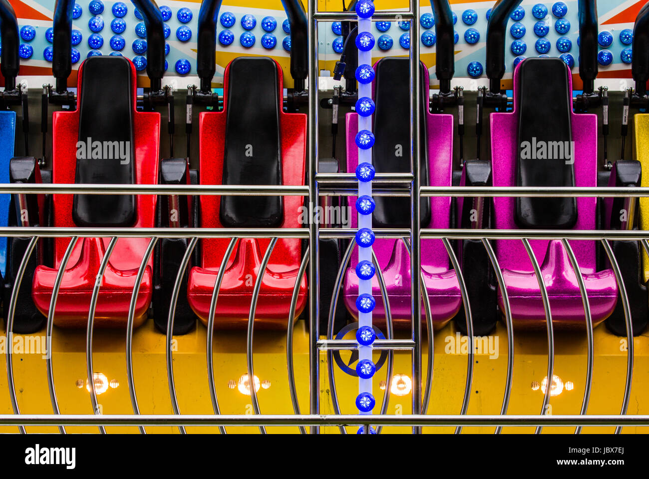 Seats from the 'Miami' ride at Kirtlington Feast funfair Stock Photo ...