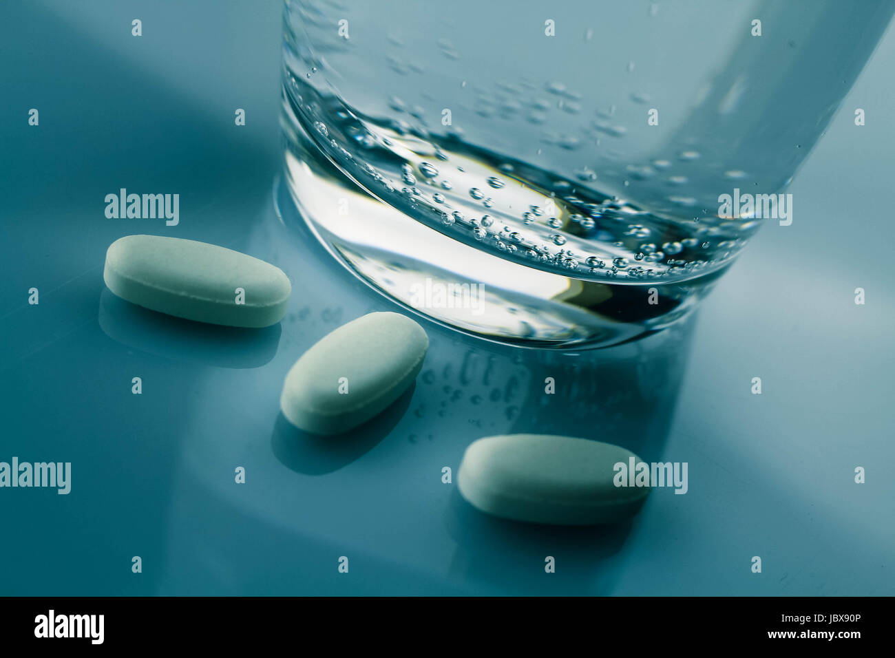 An image of a glass water with medicine Stock Photo - Alamy