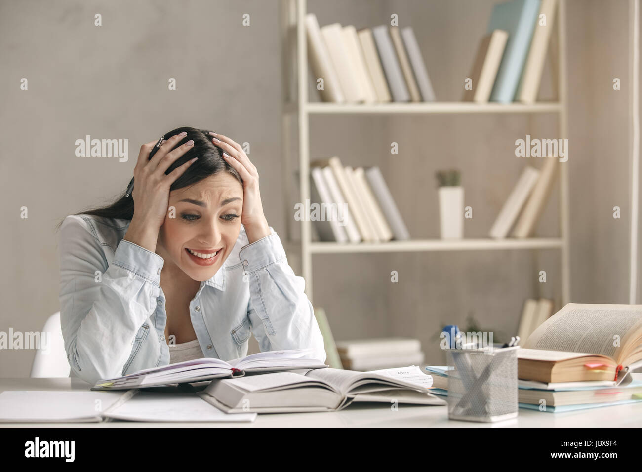 Young woman study at home alone unhappy Stock Photo - Alamy