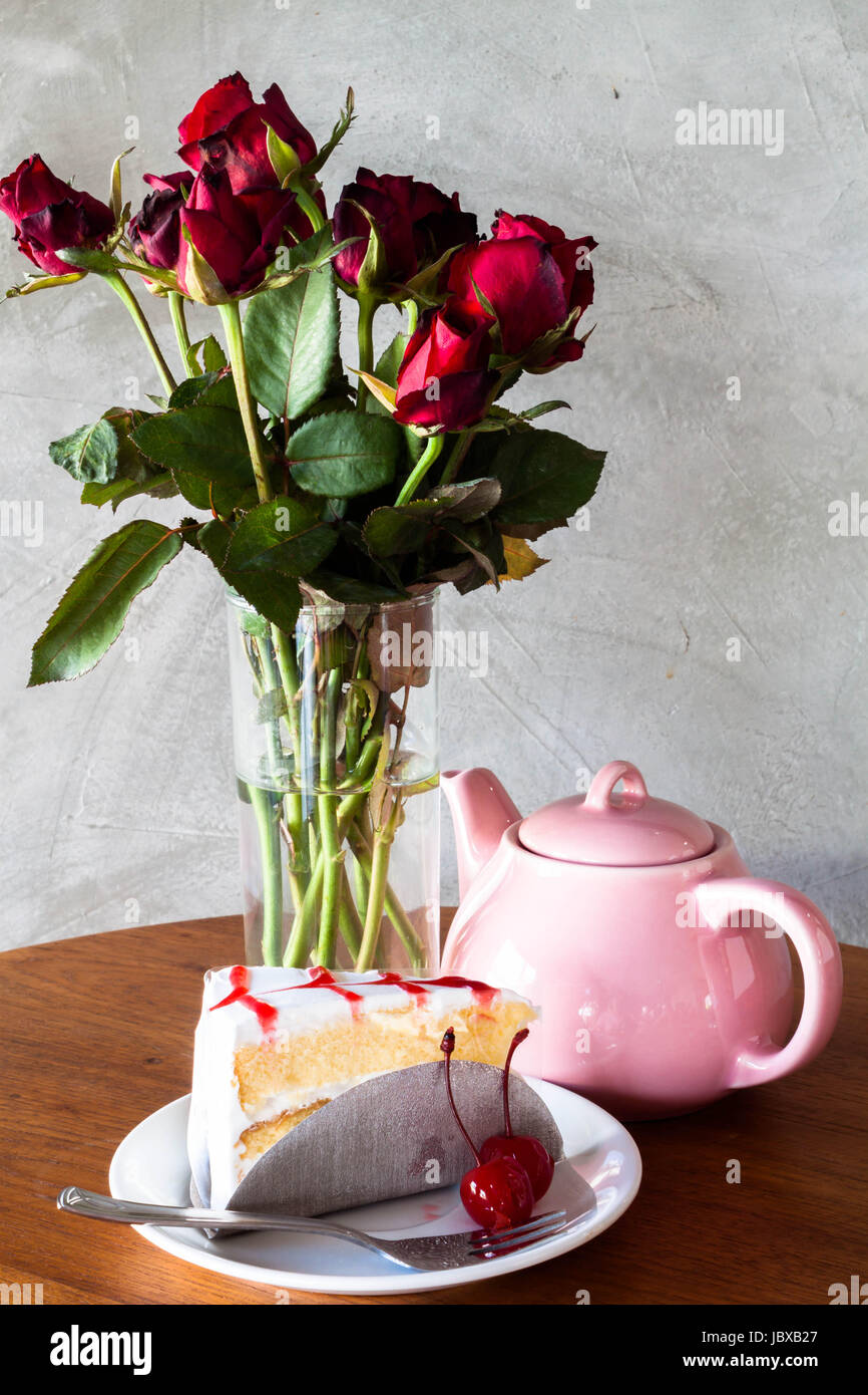Tea break with vanilla cake on wood table Stock Photo - Alamy