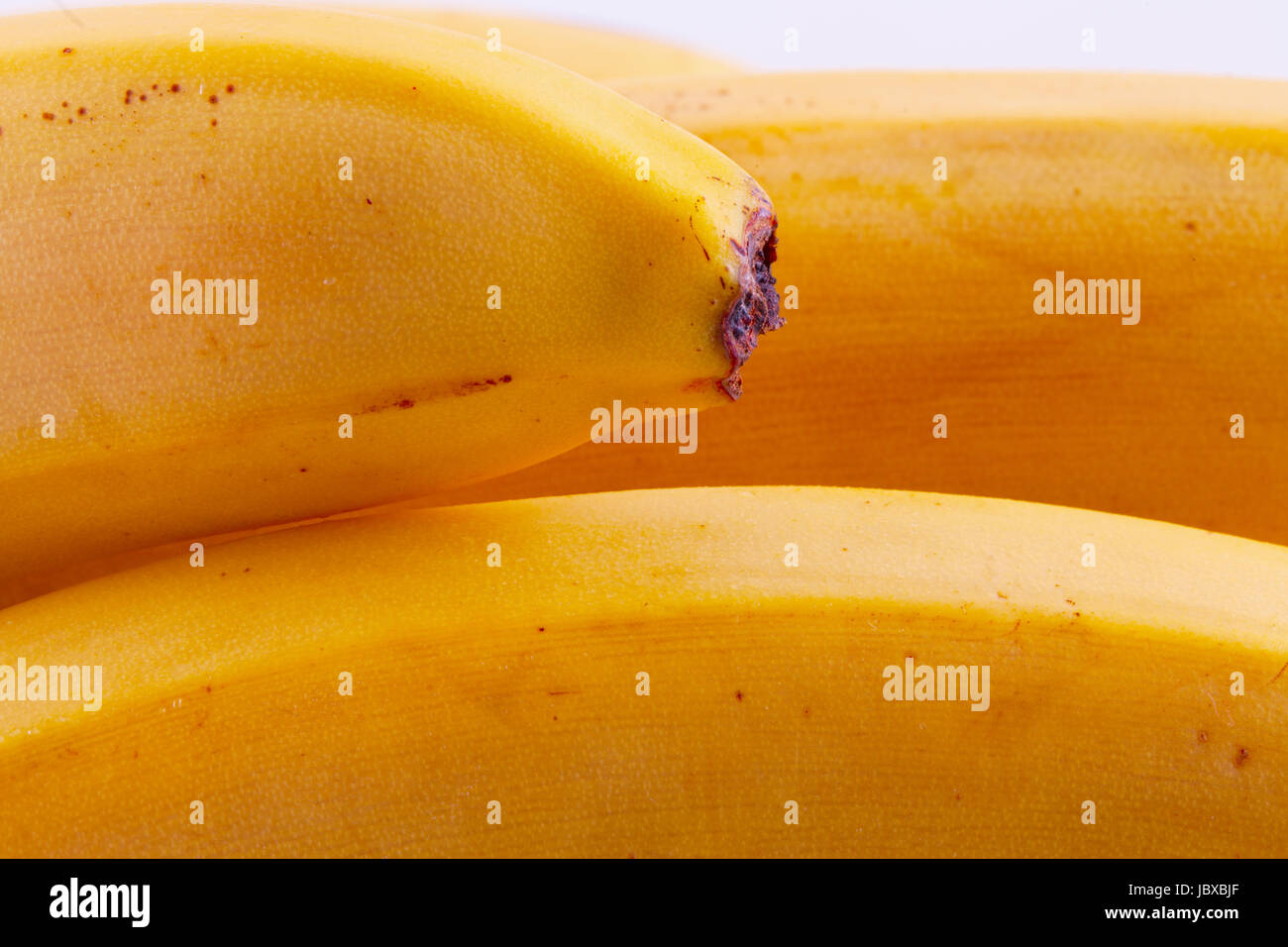 Yellow bananas in a strict close up Stock Photo - Alamy